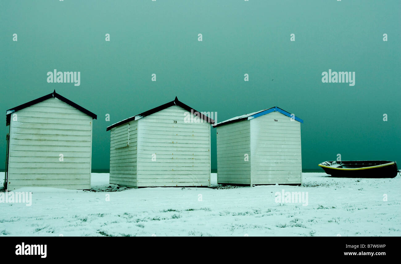 Beach Huts and Fishing Boat in Snow Stock Photo - Alamy