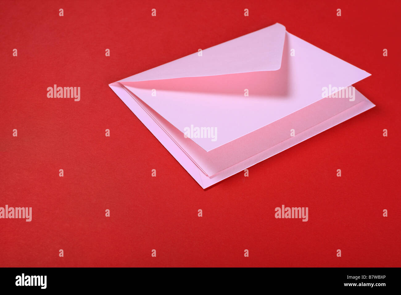 pastel pink envelope and letter on red Stock Photo - Alamy