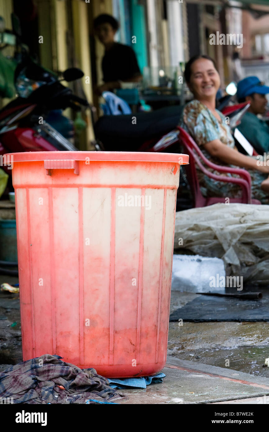 market woman with trash can Stock Photo - Alamy