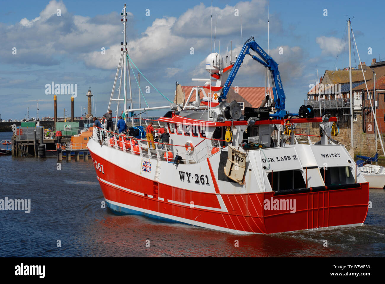 Trawler Our Lass leaving Whitby Harbour North Yorkshire England Stock ...