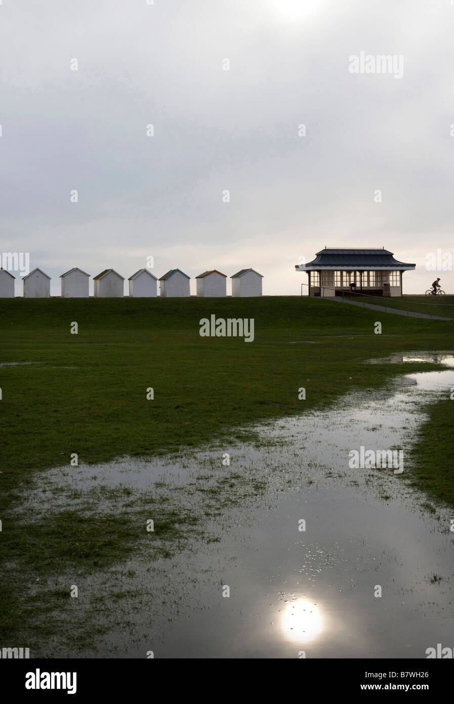 Beach Huts, Sun and Pavilion, Reflected in Flood Water Stock Photo - Alamy