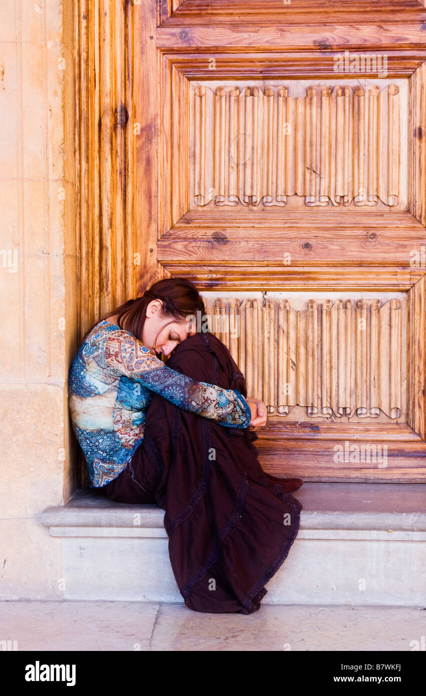 Sad elegant woman sitting and crying Stock Photo - Alamy