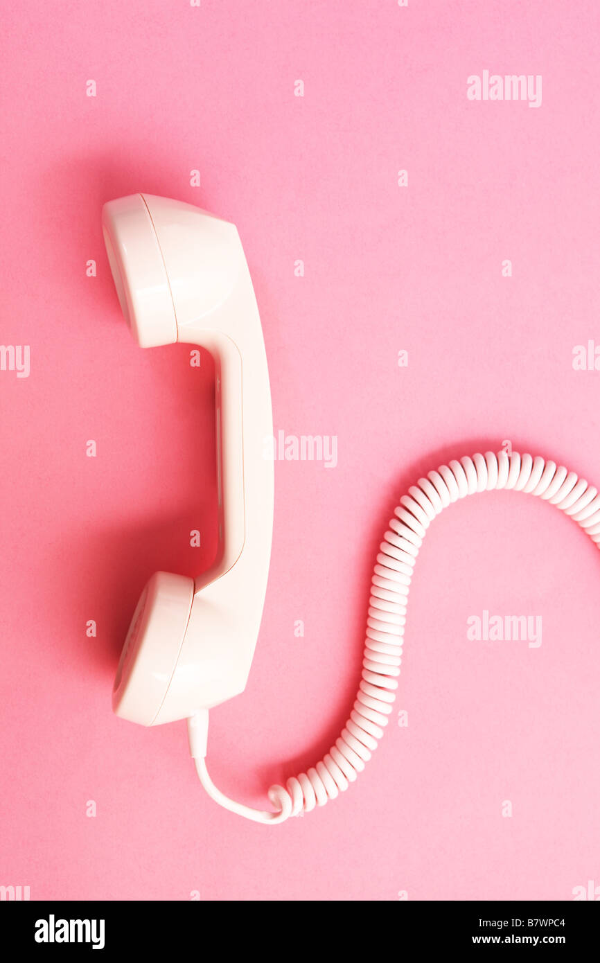 a pink telephone on a pink background Stock Photo - Alamy