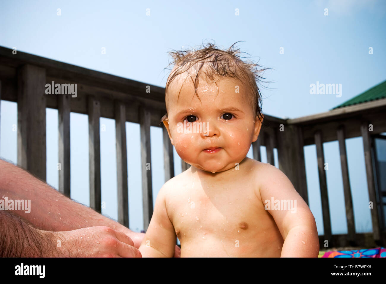 wet baby staring into camera Stock Photo - Alamy