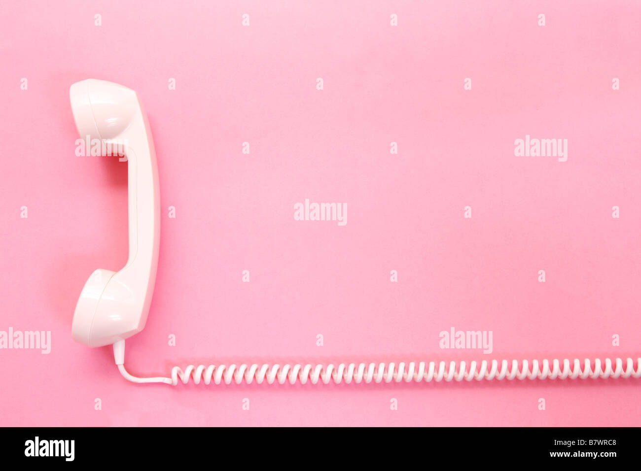 a pink telephone on a pink background Stock Photo - Alamy
