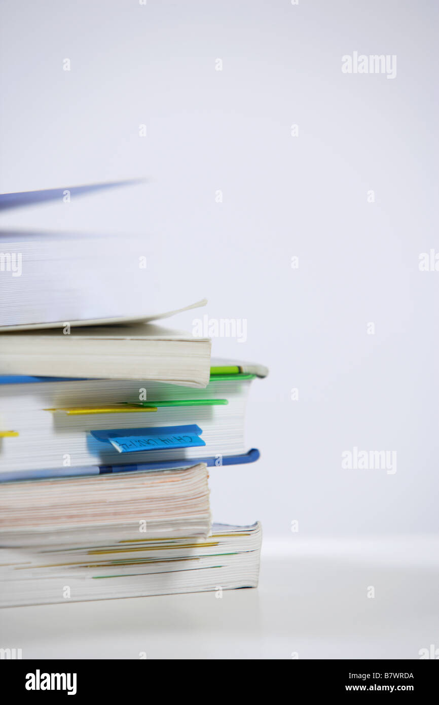 A stack of text books on a desk Stock Photo - Alamy