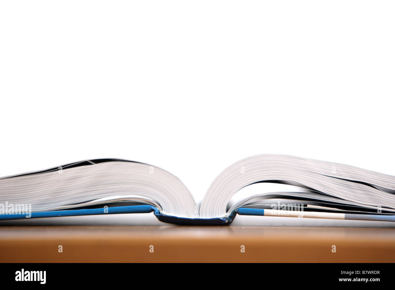 An open book on a desk Stock Photo - Alamy