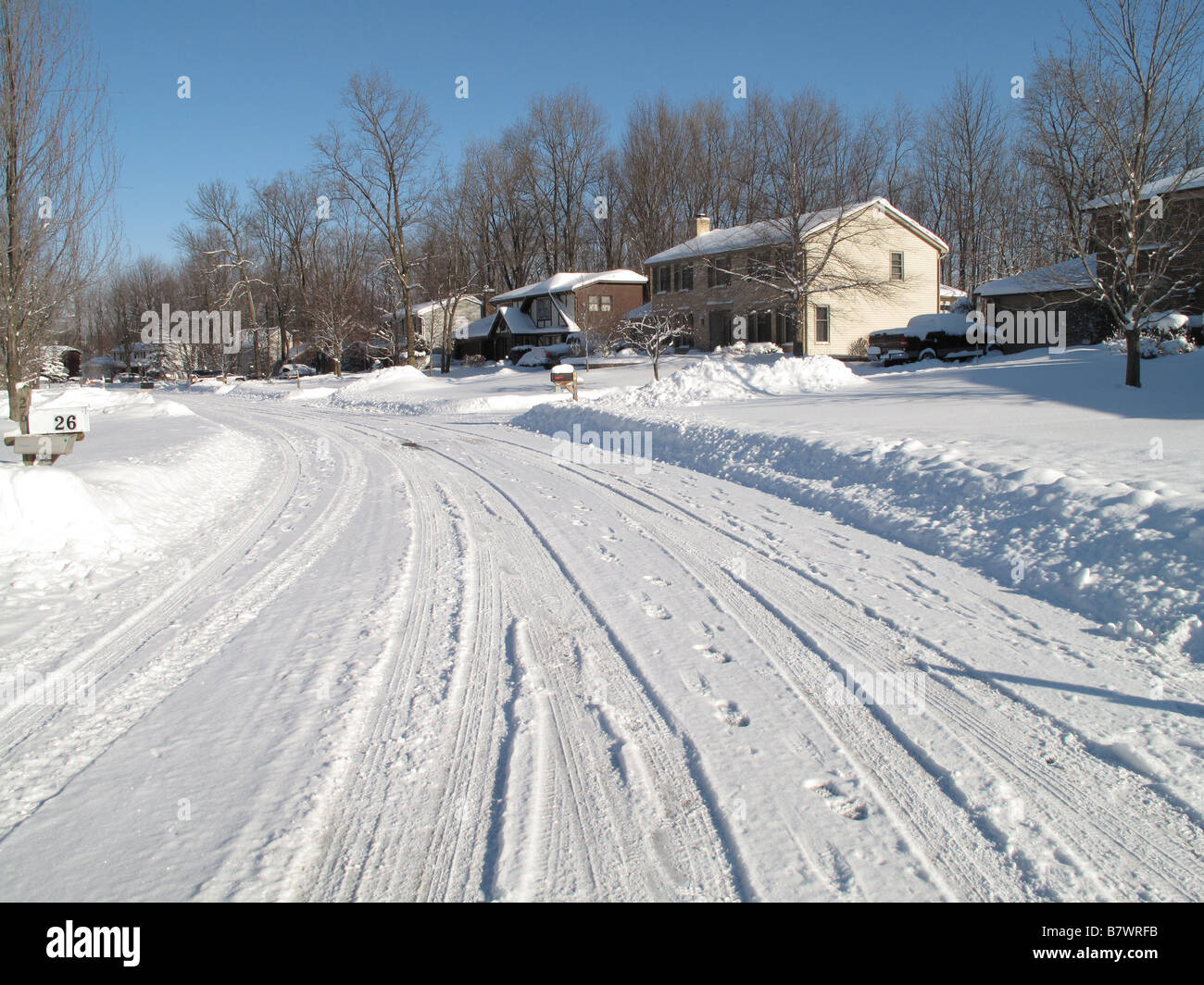 Suburban street after snow storm Stock Photo - Alamy