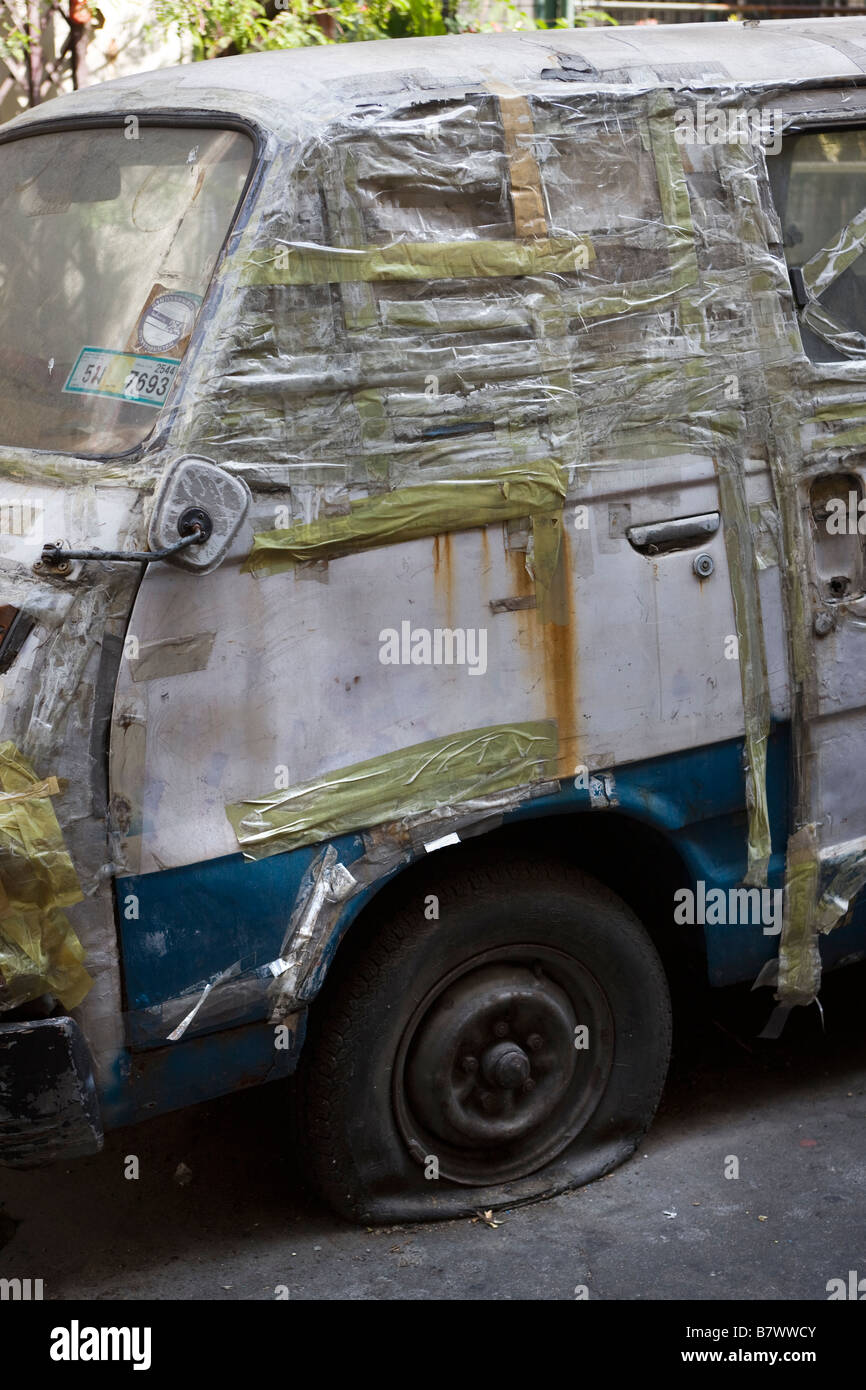 Damaged Vehicle with Taped up Windows Stock Photo - Alamy