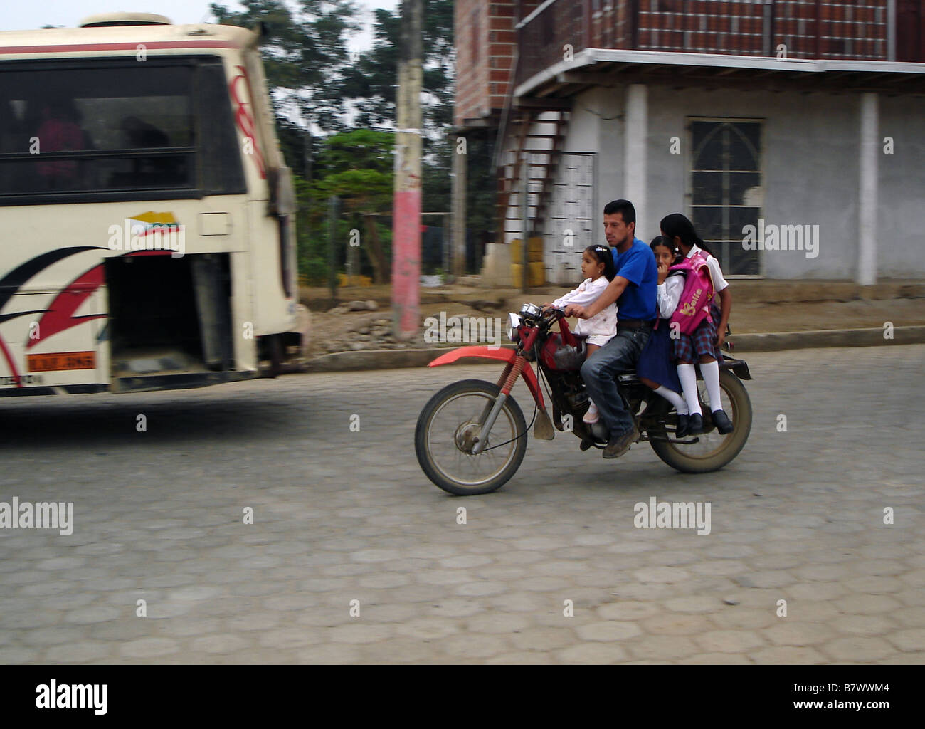 Four young children on motorcycle in Ecuador Stock Photo - Alamy
