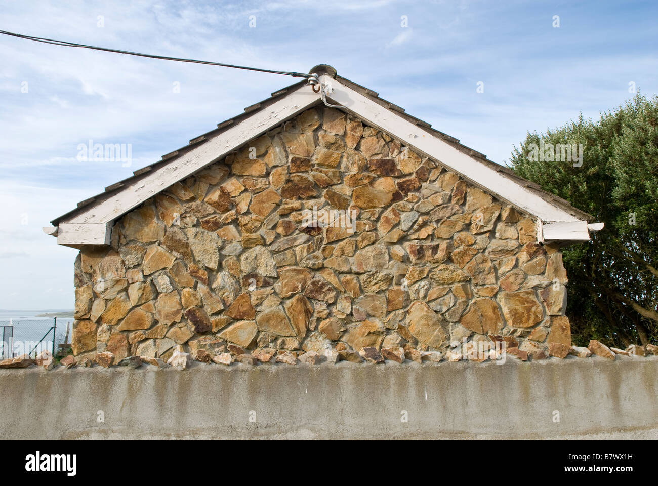Brick house wall and powerline, Howth Peninsula, Dublin Ireland, August ...