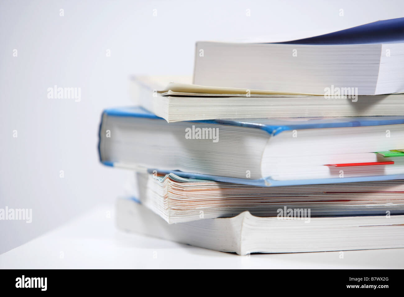 A stack of text books on a desk Stock Photo - Alamy