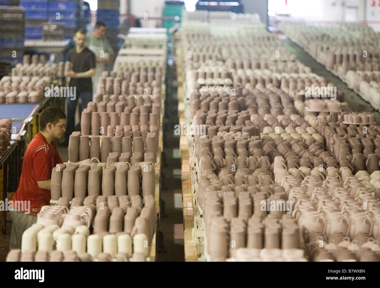 Pottery teapots cups saucers and plates are prepared before entering a ...