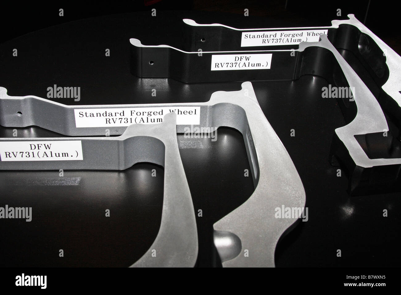 Close shot of display slices of cross section of various types of alloy ...