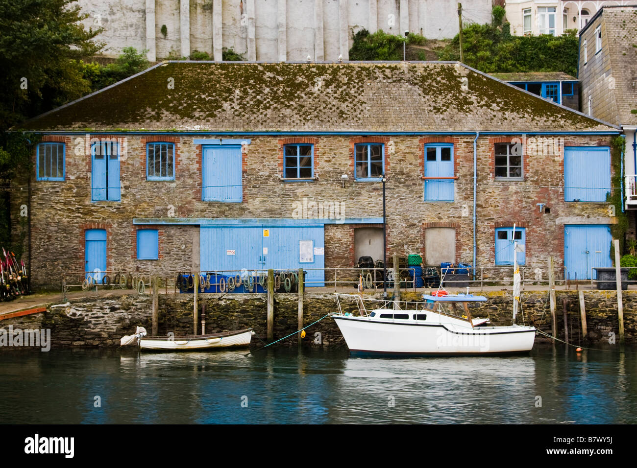 Quayside warehouse Looe harbour, Cornwall, UK Stock Photo - Alamy