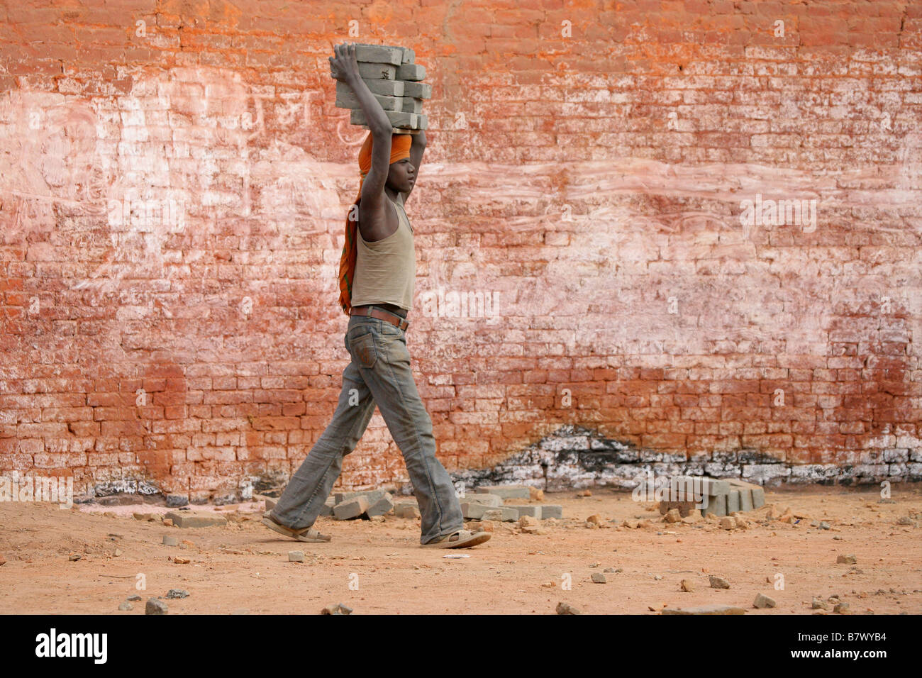 Bricks on head Stock Photo - Alamy