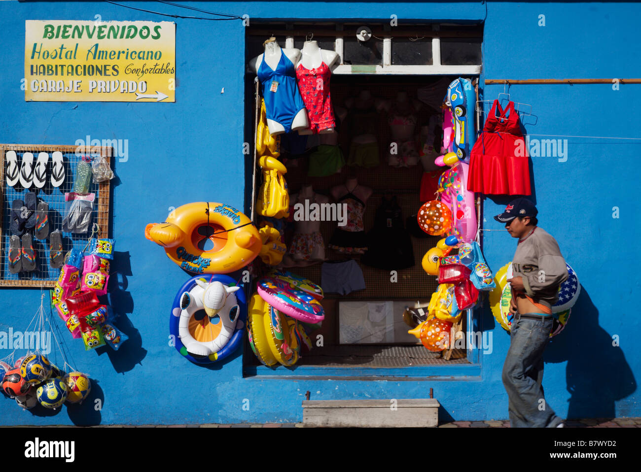 Shop with blue wall in Banos, Ecuador Stock Photo - Alamy