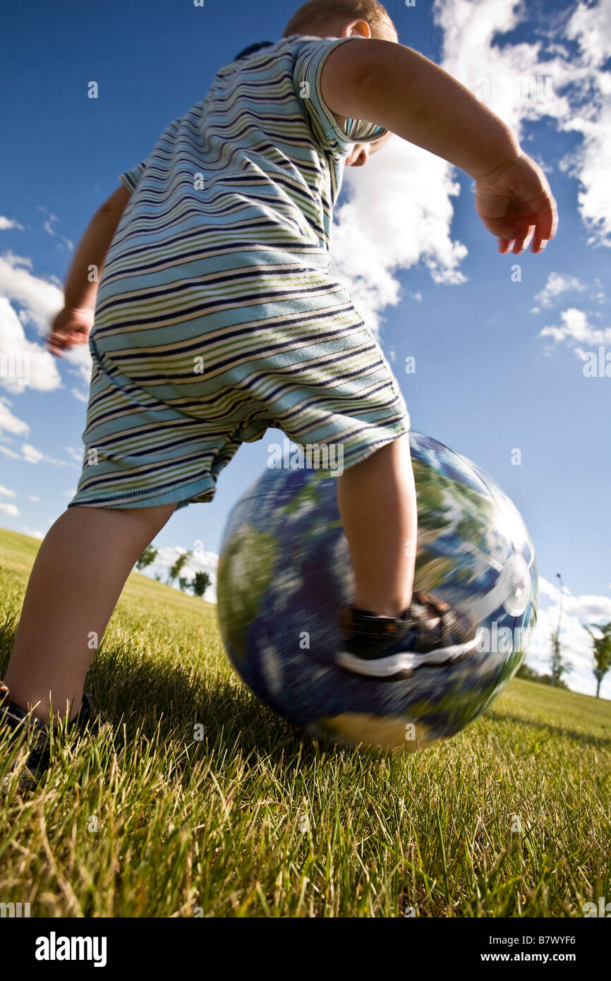 Child playing with ball Stock Photo - Alamy