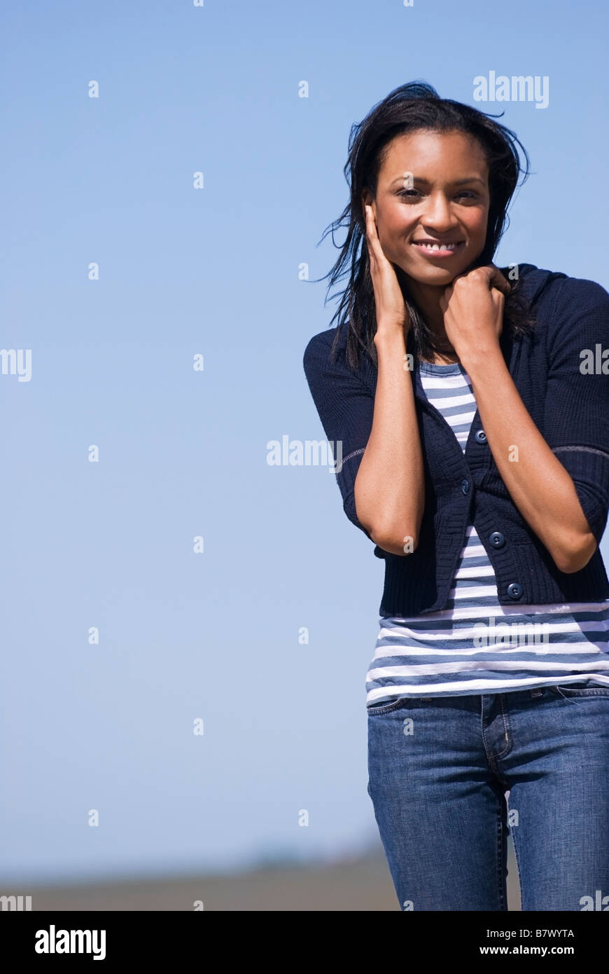 Woman and blue sky Stock Photo - Alamy