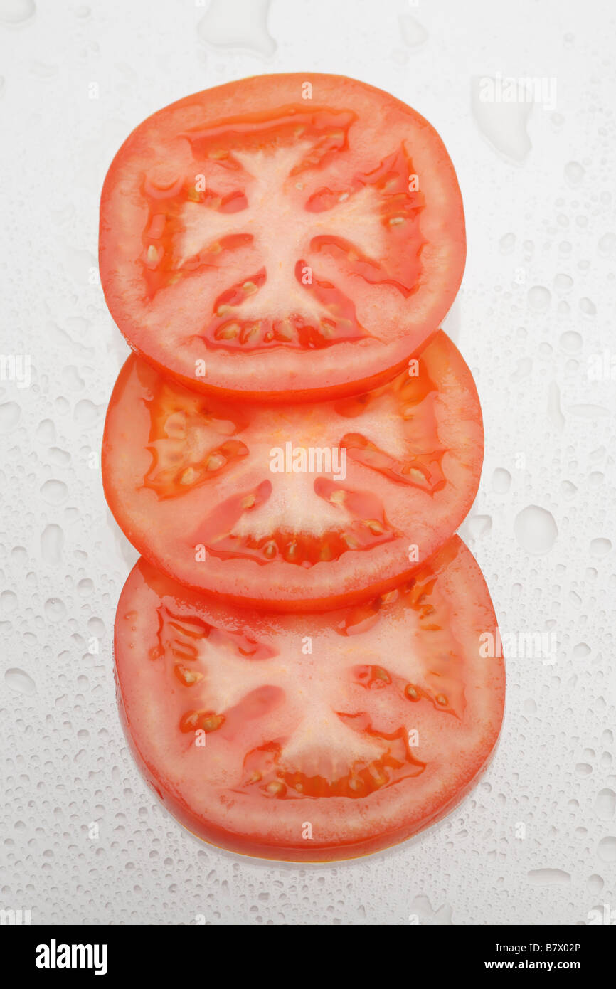 Tomatoes, slices, close-up, studio shot Stock Photo - Alamy
