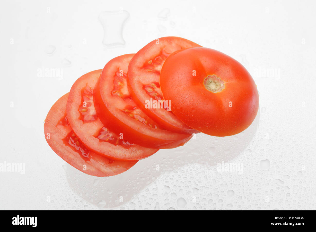 Tomatoes, slices, close-up, studio shot Stock Photo - Alamy