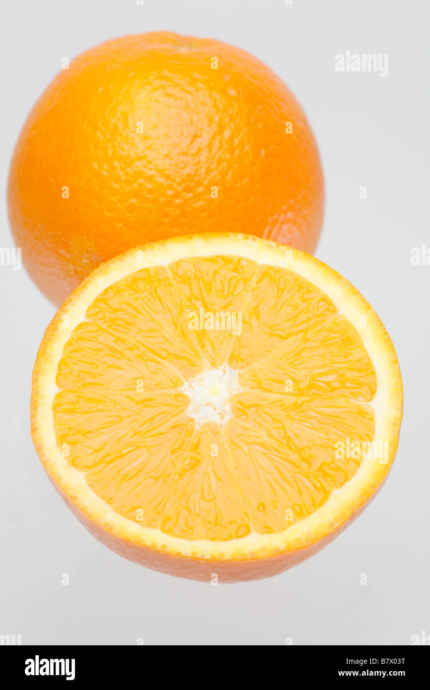 Halves of oranges, studio shot Stock Photo - Alamy