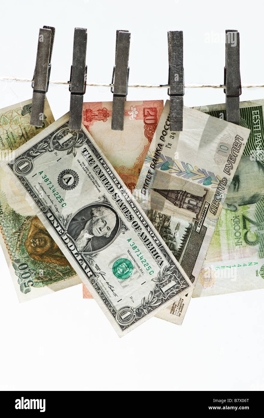 International Bank Notes pegged to a line Isolated on white Stock Photo ...