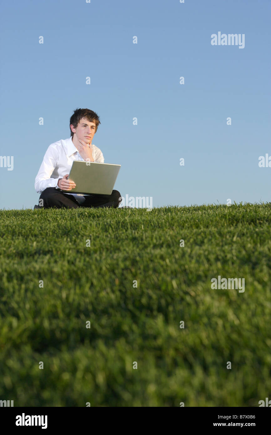 A Business man working outside in a park Stock Photo - Alamy