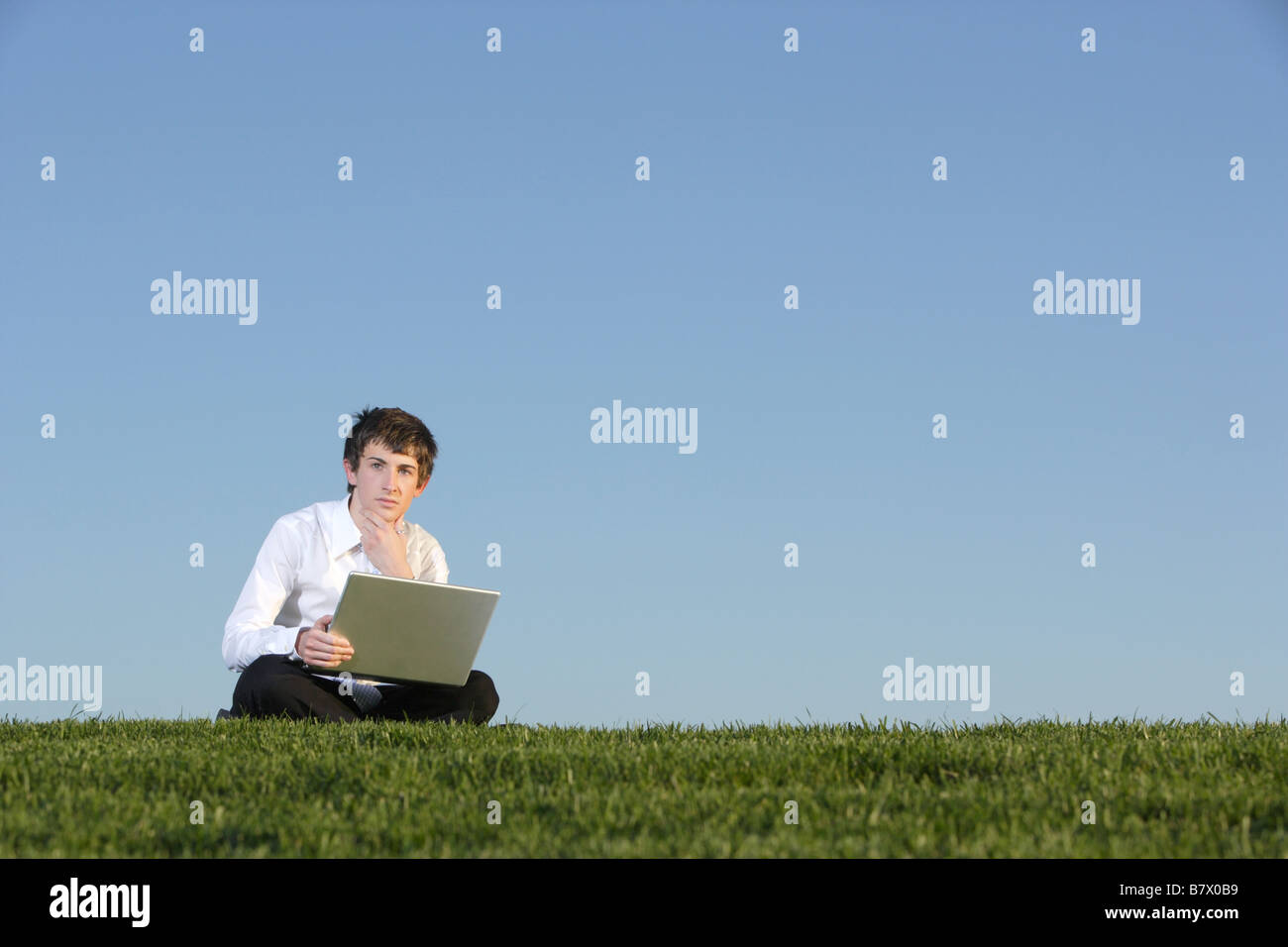 A Business man working outside in a park Stock Photo - Alamy