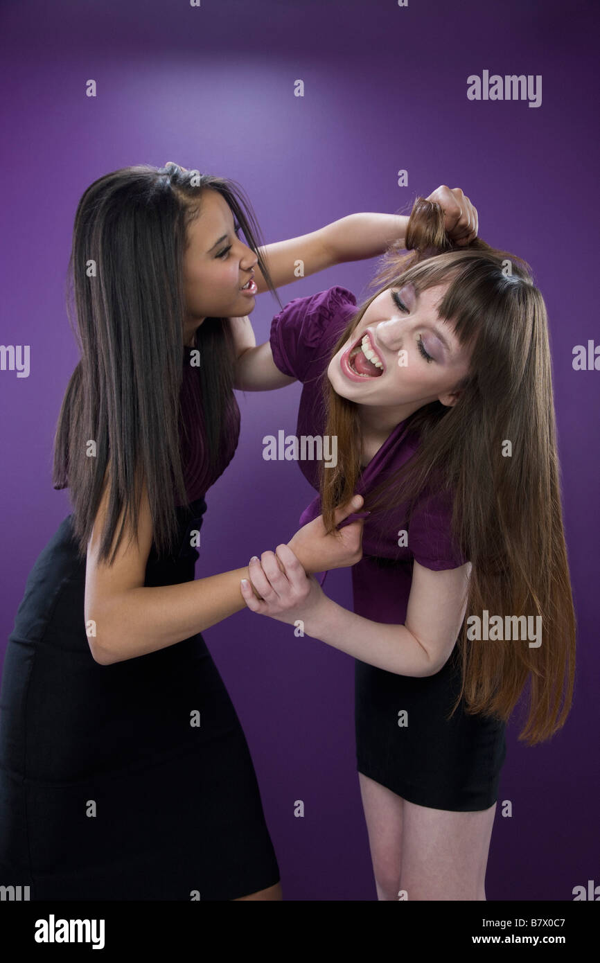 Two women fighting Stock Photo - Alamy