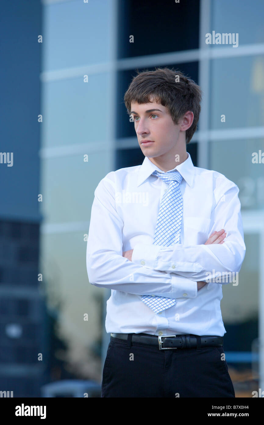 A business man in front of an office building Stock Photo - Alamy