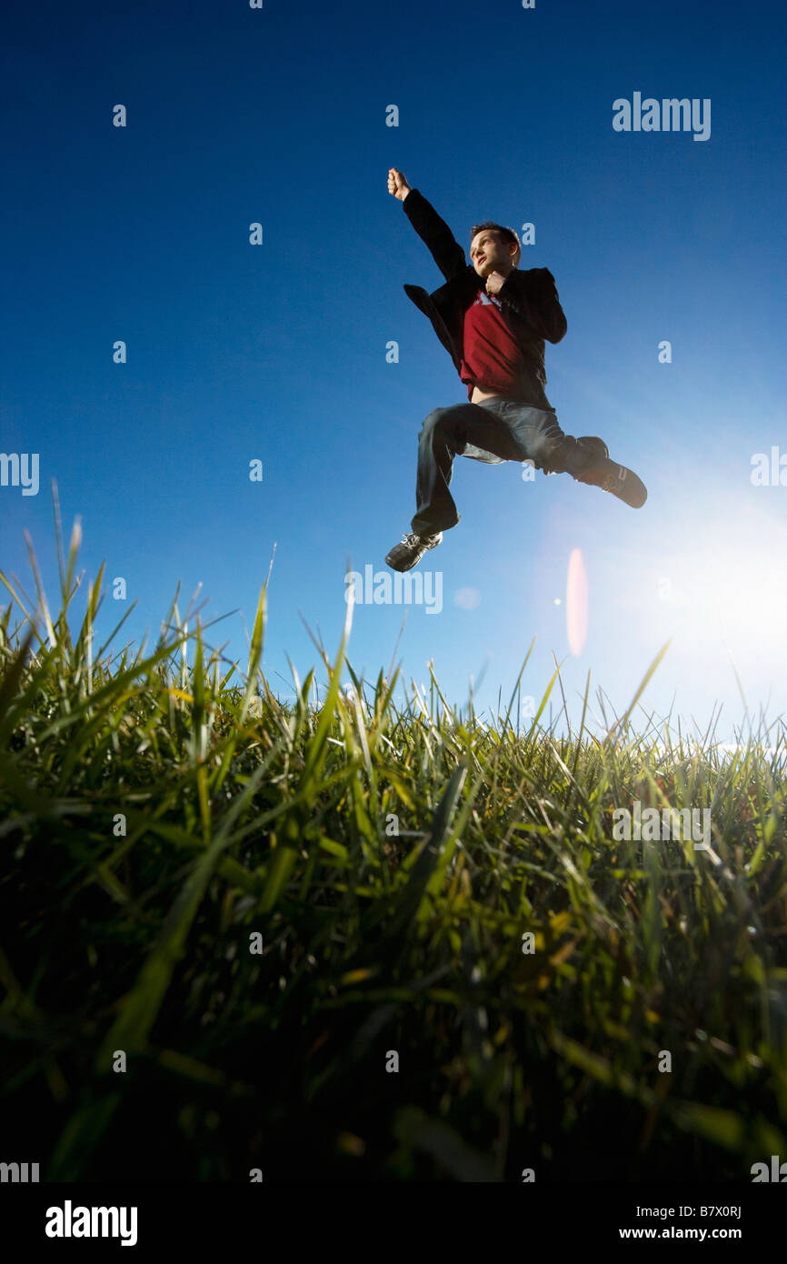Boy jumping for joy Stock Photo - Alamy