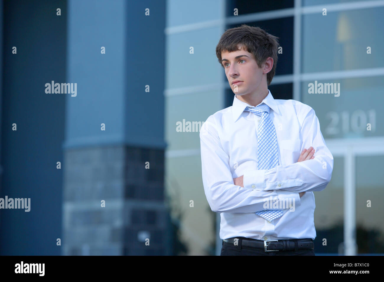 A business man in front of an office building Stock Photo - Alamy