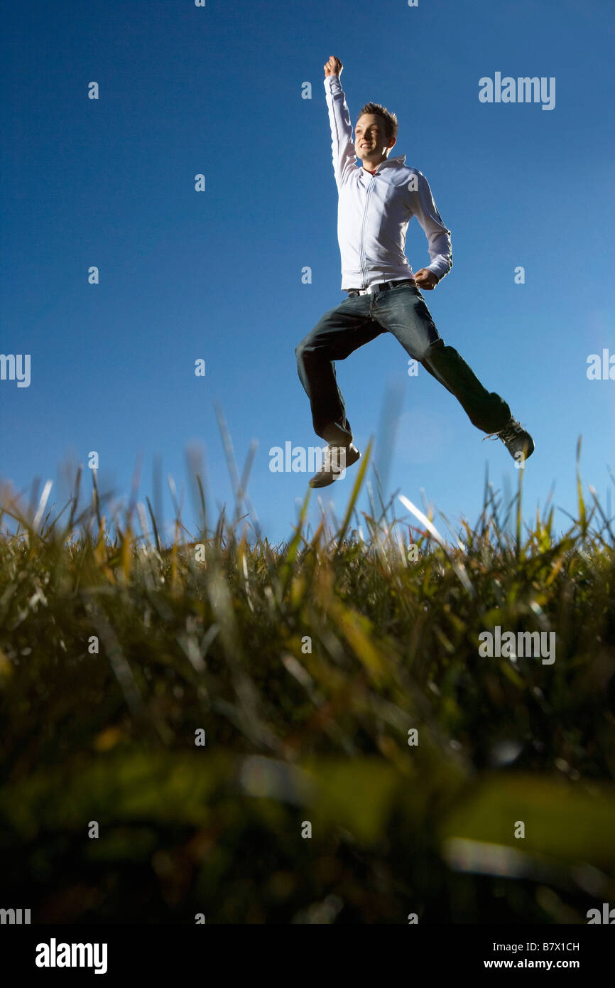 Boy jumping for joy Stock Photo - Alamy