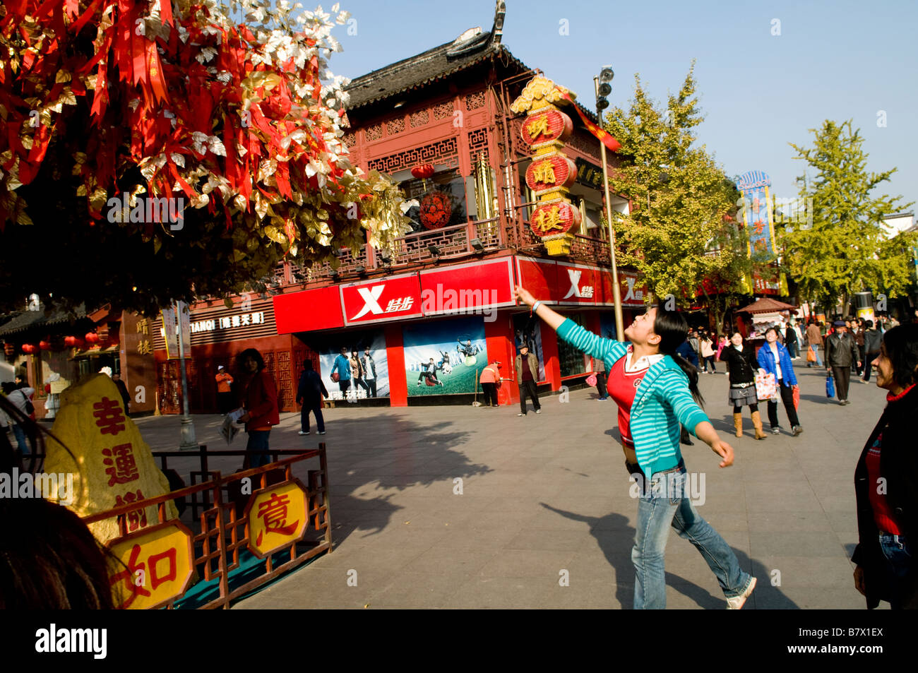 People try their luck throwing a good luck ribbon for lots of success ...
