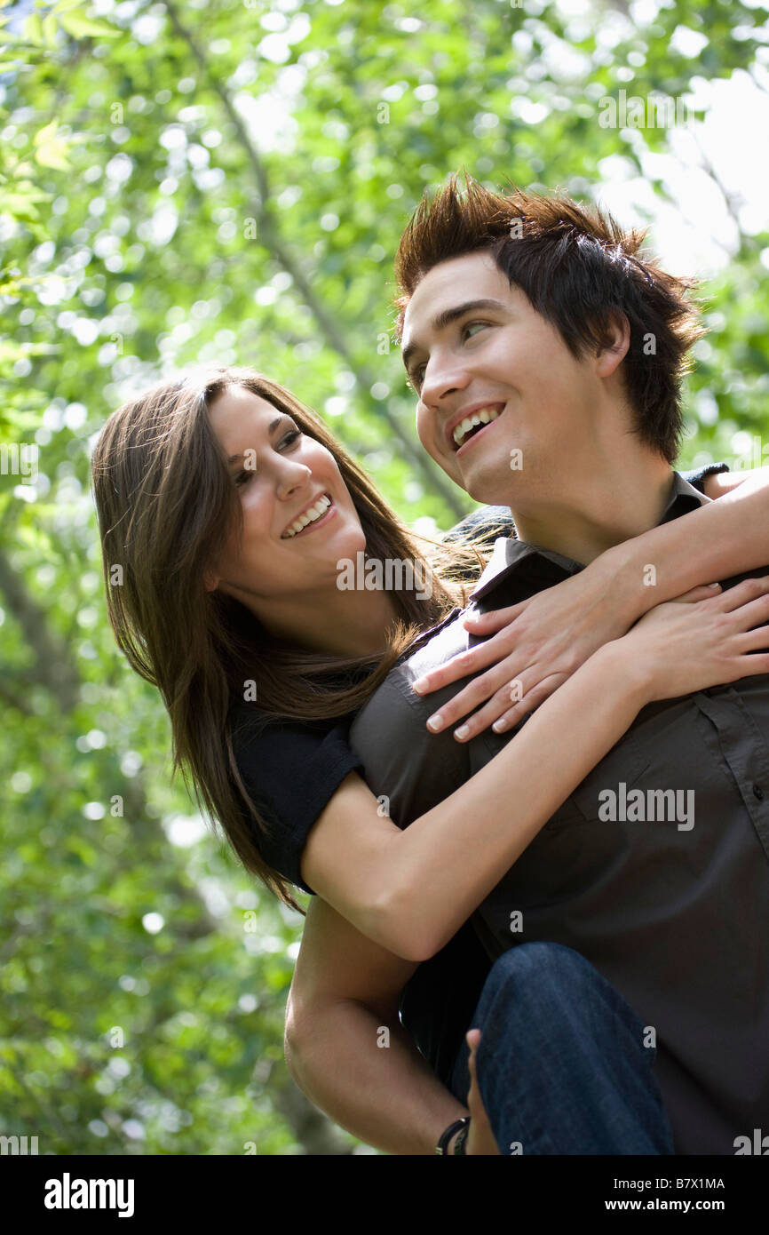 Man giving woman ride on his back Stock Photo - Alamy