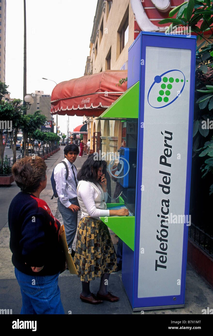 Peruvians, Peruvian people waiting in line, public telephone, pay ...