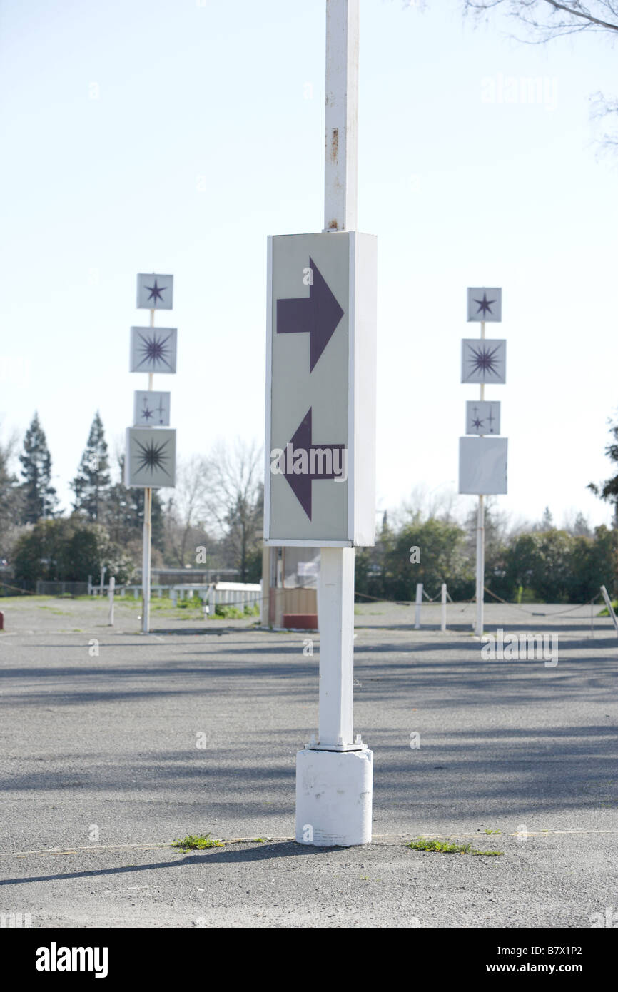 An arrow sign in a parking lot Stock Photo - Alamy