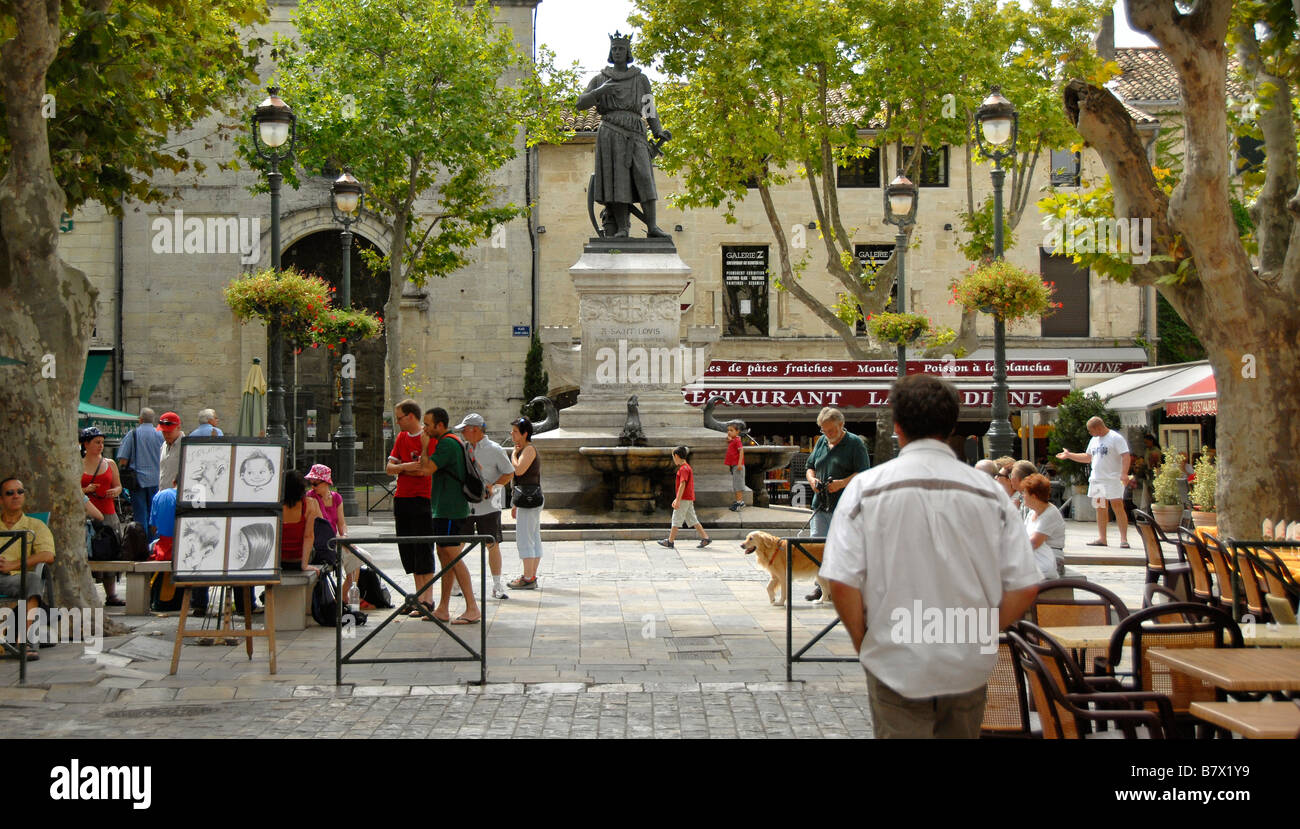People in the medieval town square, Statue King Louis IX, Aigues Mortes ...
