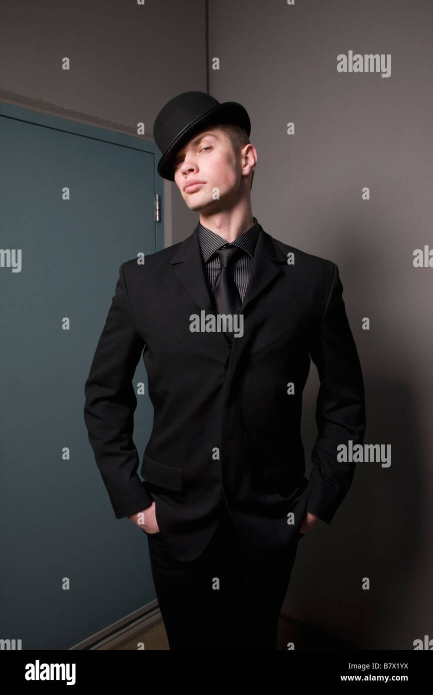 Man in business suit and bowler hat Stock Photo - Alamy