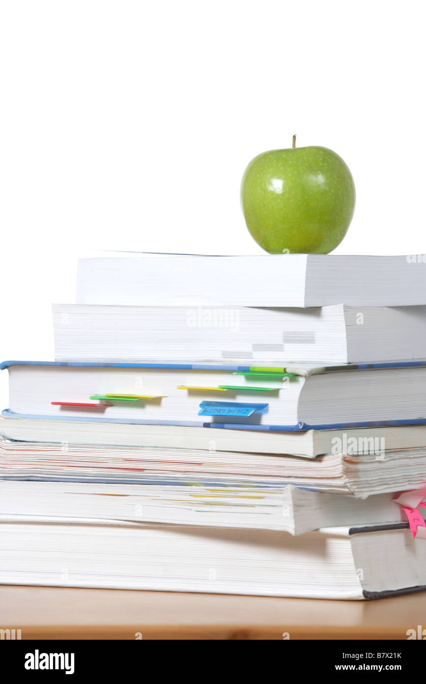 An apple on top of a stack of books Stock Photo - Alamy
