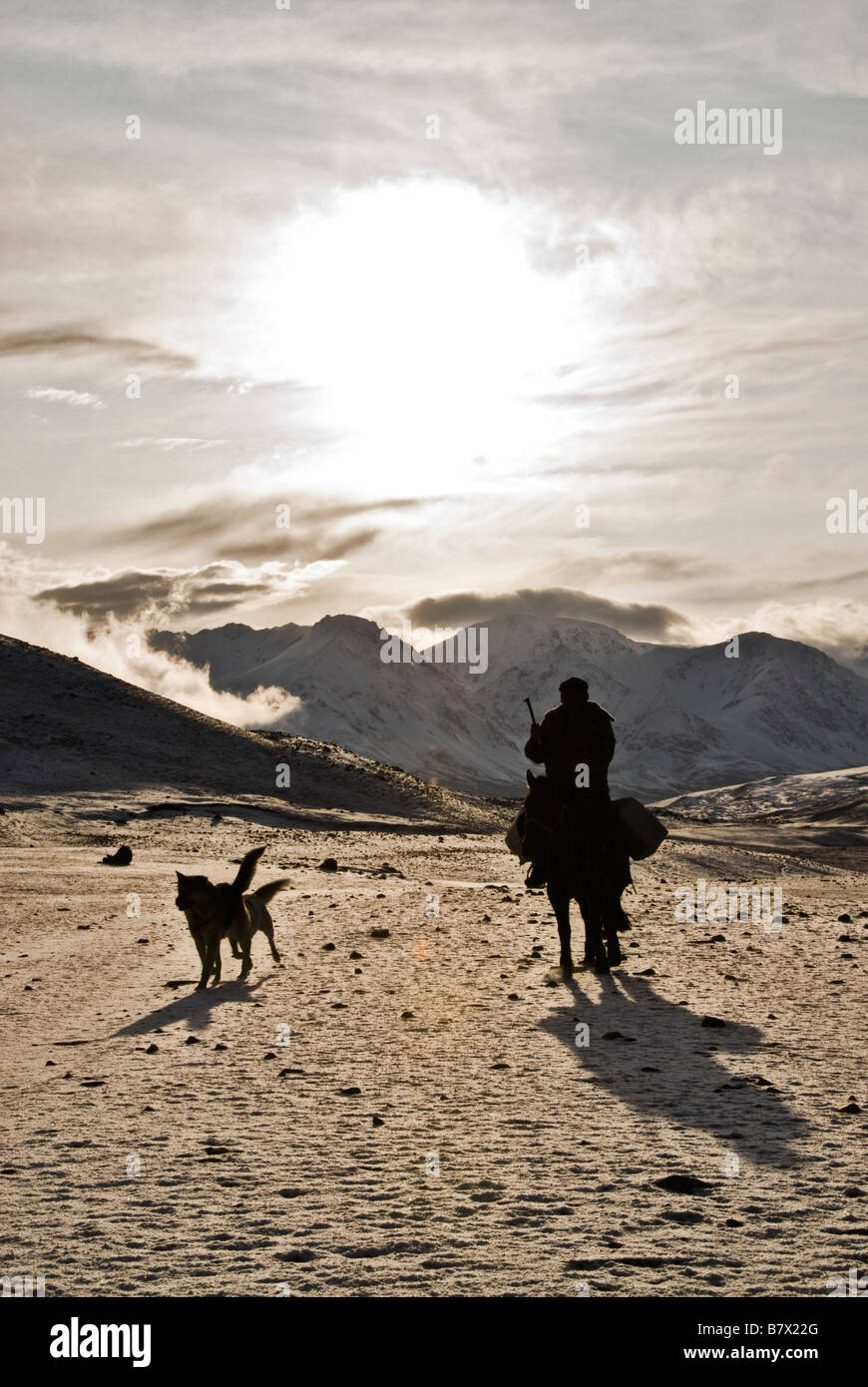 Mongolian man riding a horse Altai Tavan Bogd National Park Mongolia ...