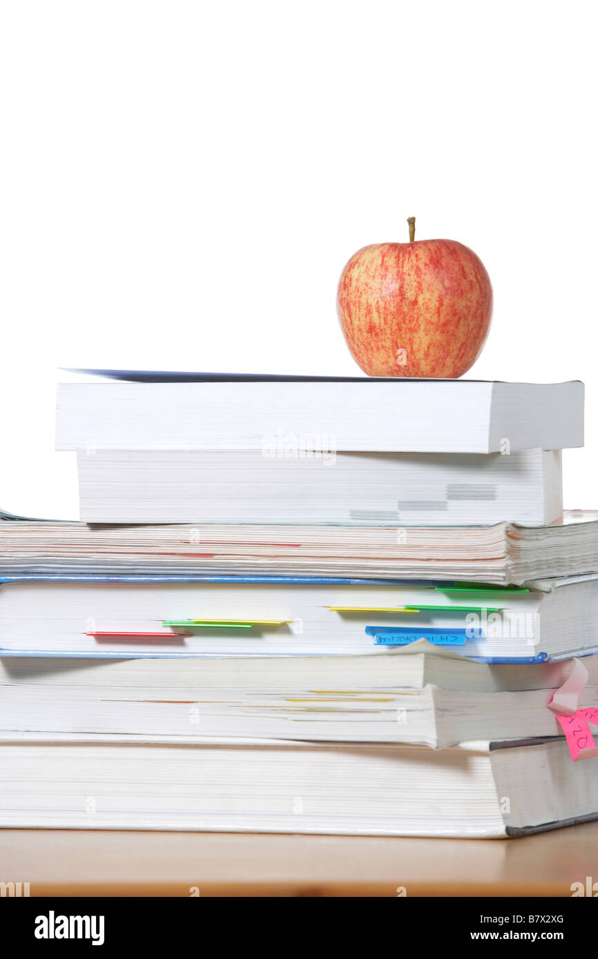 An apple on top of a stack of books Stock Photo - Alamy