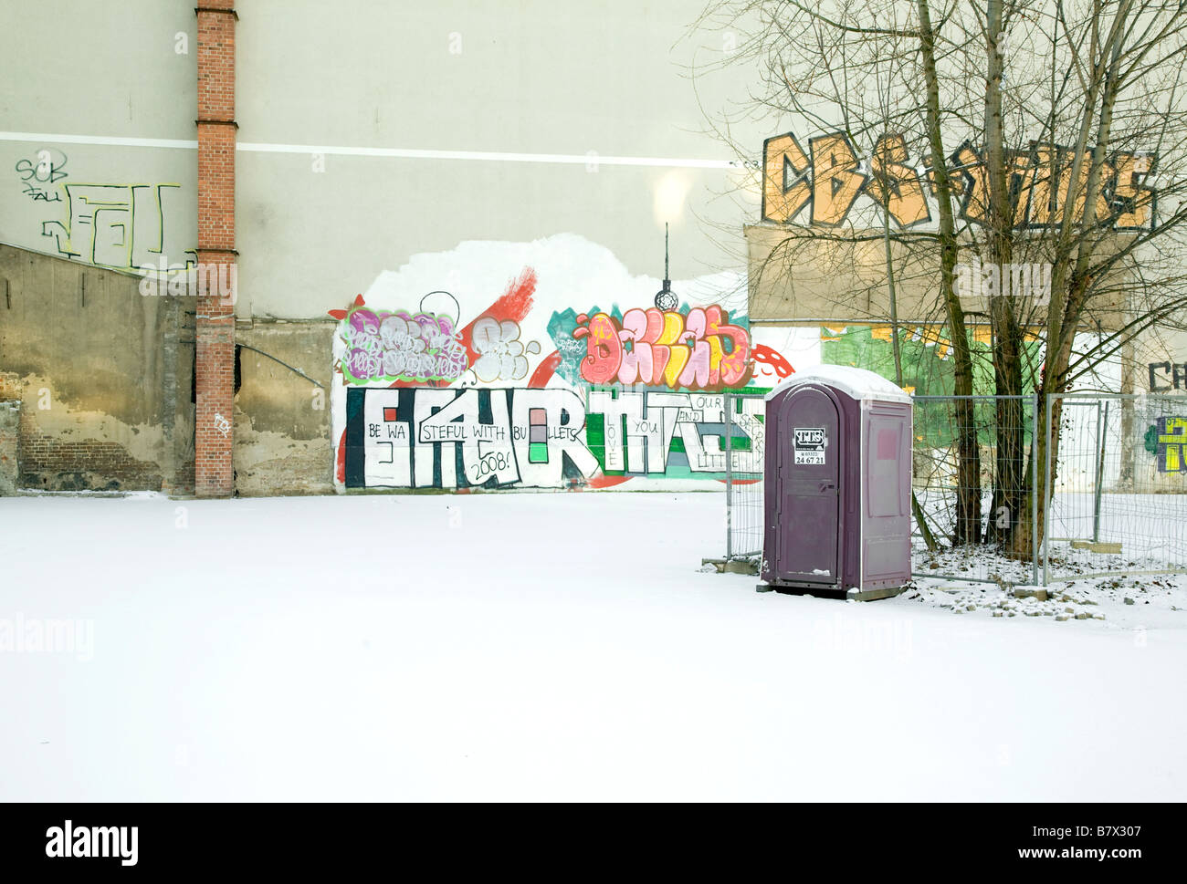 outdoor toilet in a snow scene with grafitti Stock Photo - Alamy