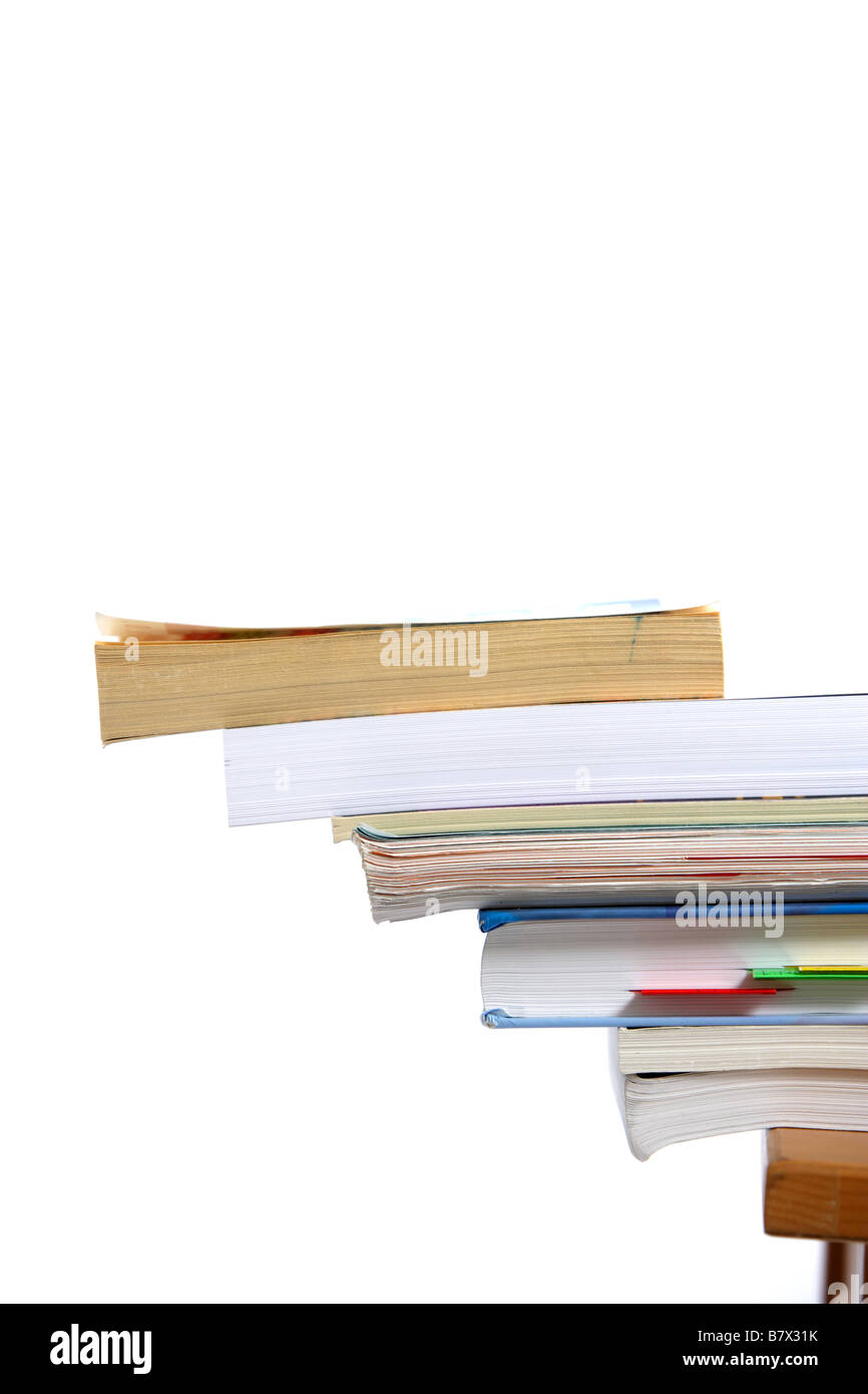 Stack of books falling off a school desk Stock Photo - Alamy