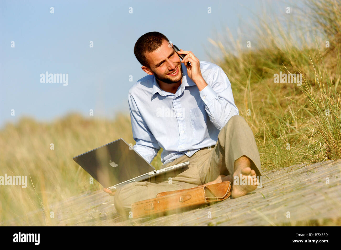 Beach with laptop and cell phone hi-res stock photography and images ...