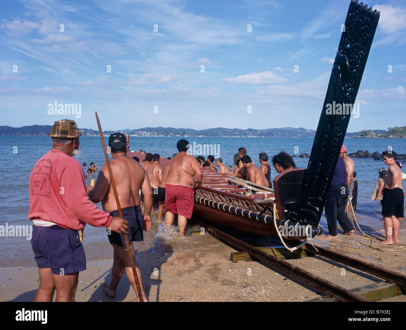 Waitangi Maori warriors launching war canoe Sand Bare backs Shorts ...