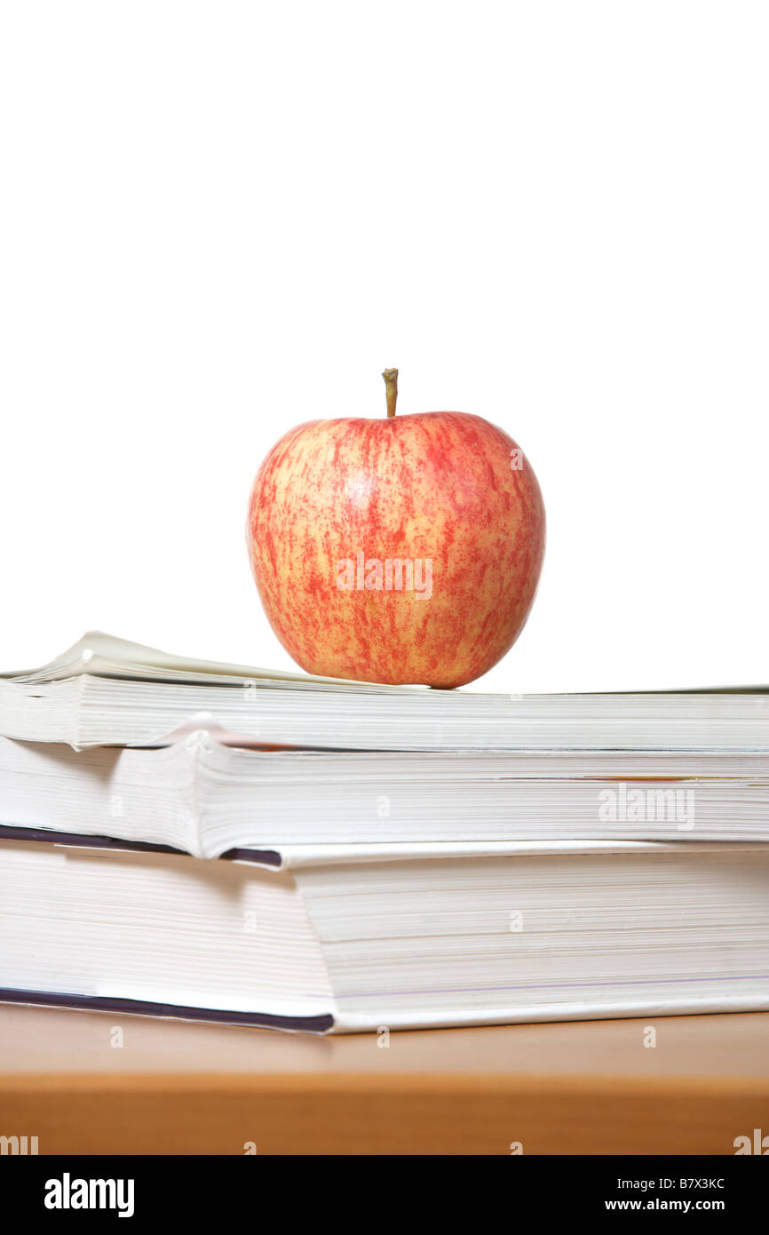 An apple on top of a stack of books Stock Photo - Alamy