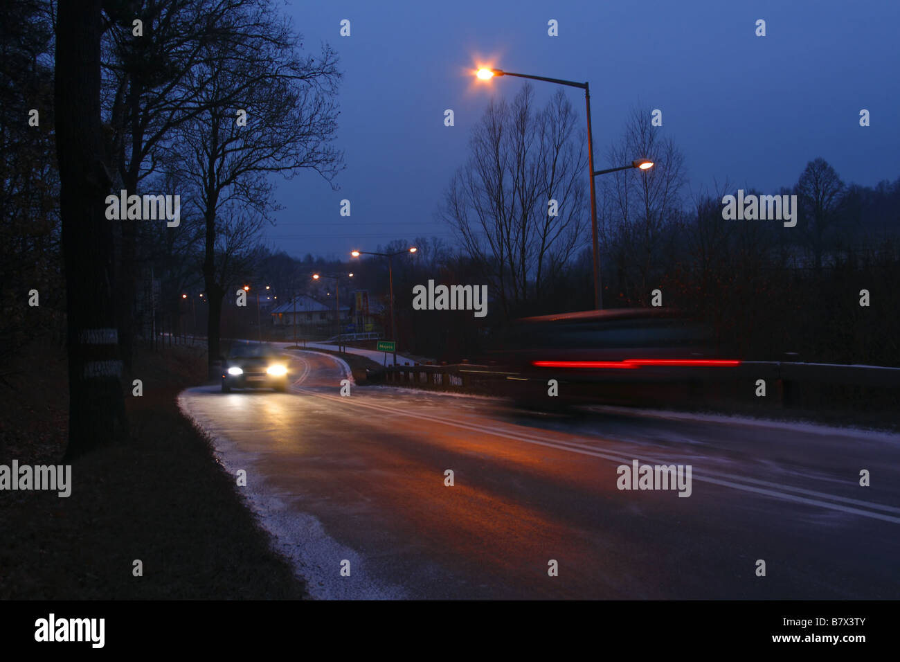 Road sign night blur hi-res stock photography and images - Alamy