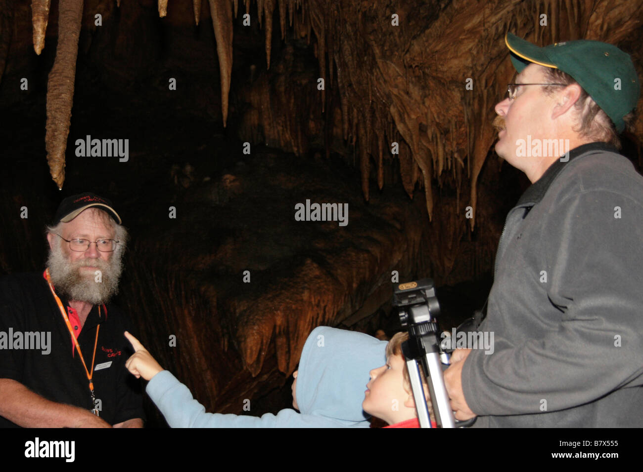 cave guide and tourists Stock Photo - Alamy